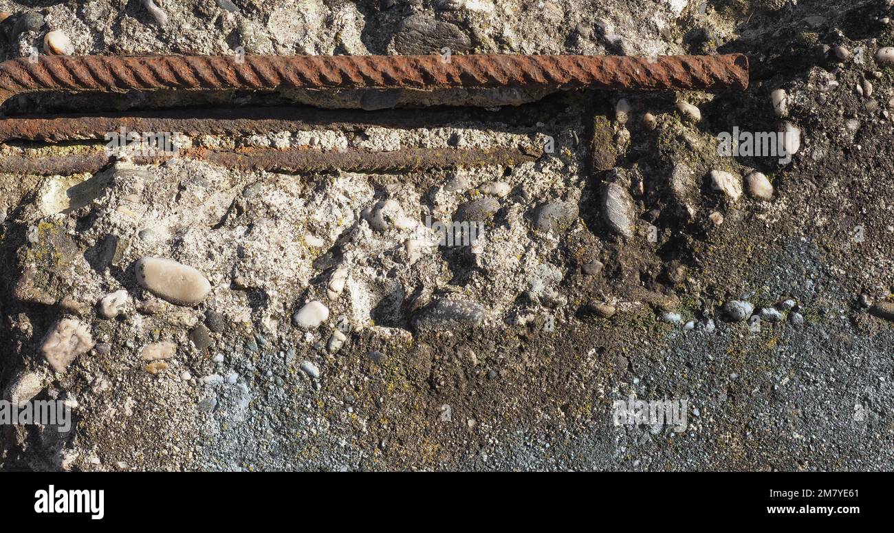 damaged reinforced concrete with exposed rusted steel resistance bars ...