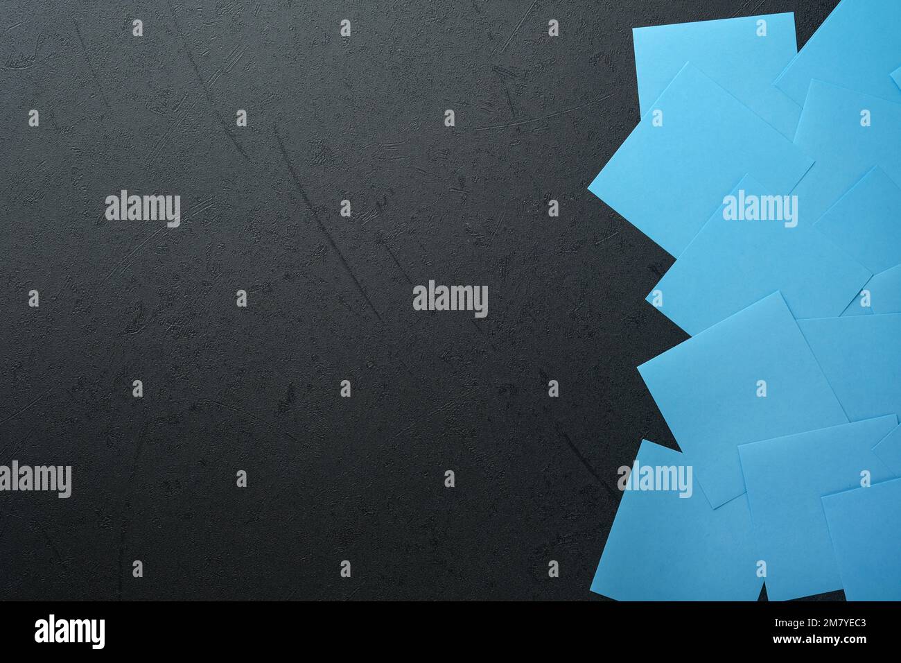 Blue paper stickers on black background. Sticky notes blank with copy ...