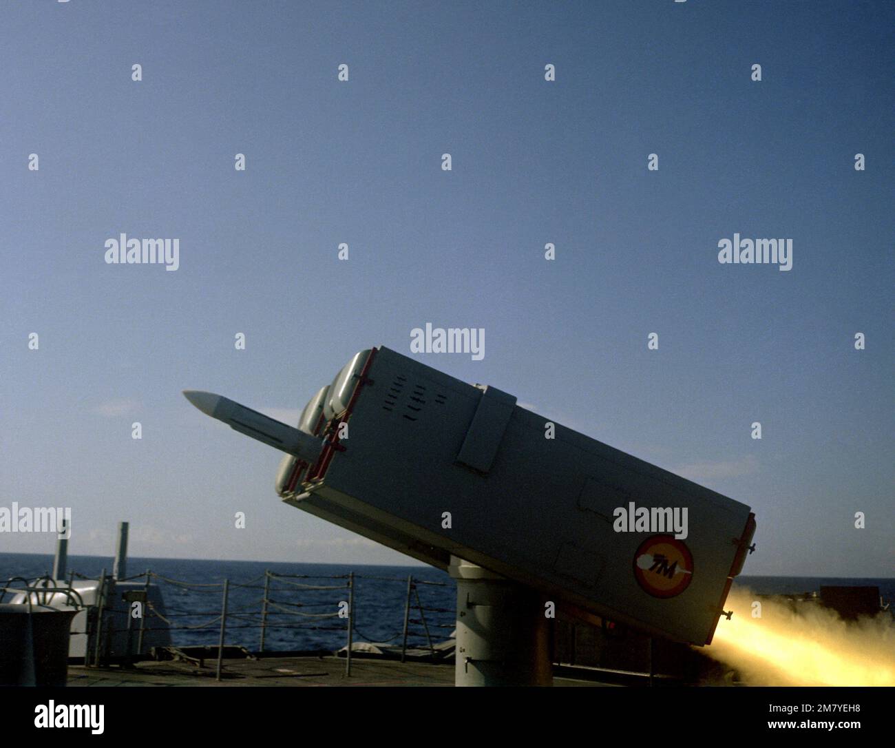 An RIM-7H Sea Sparrow missile emerges from its launch tube aboard the ...