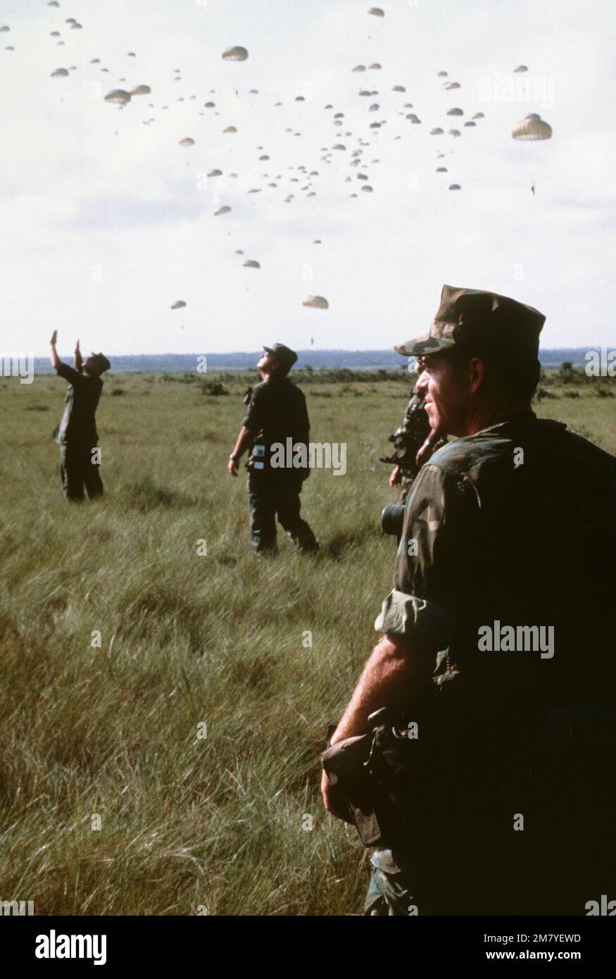 A combat control team observes as paratroopers from the 2nd Battalion ...