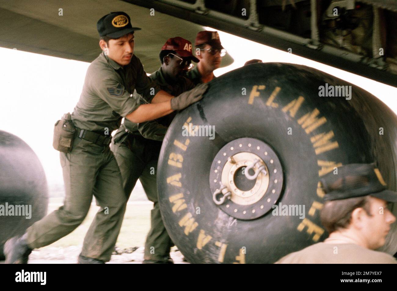 Aerial Port Squadron personnel load blivets (portable fuel containers ...