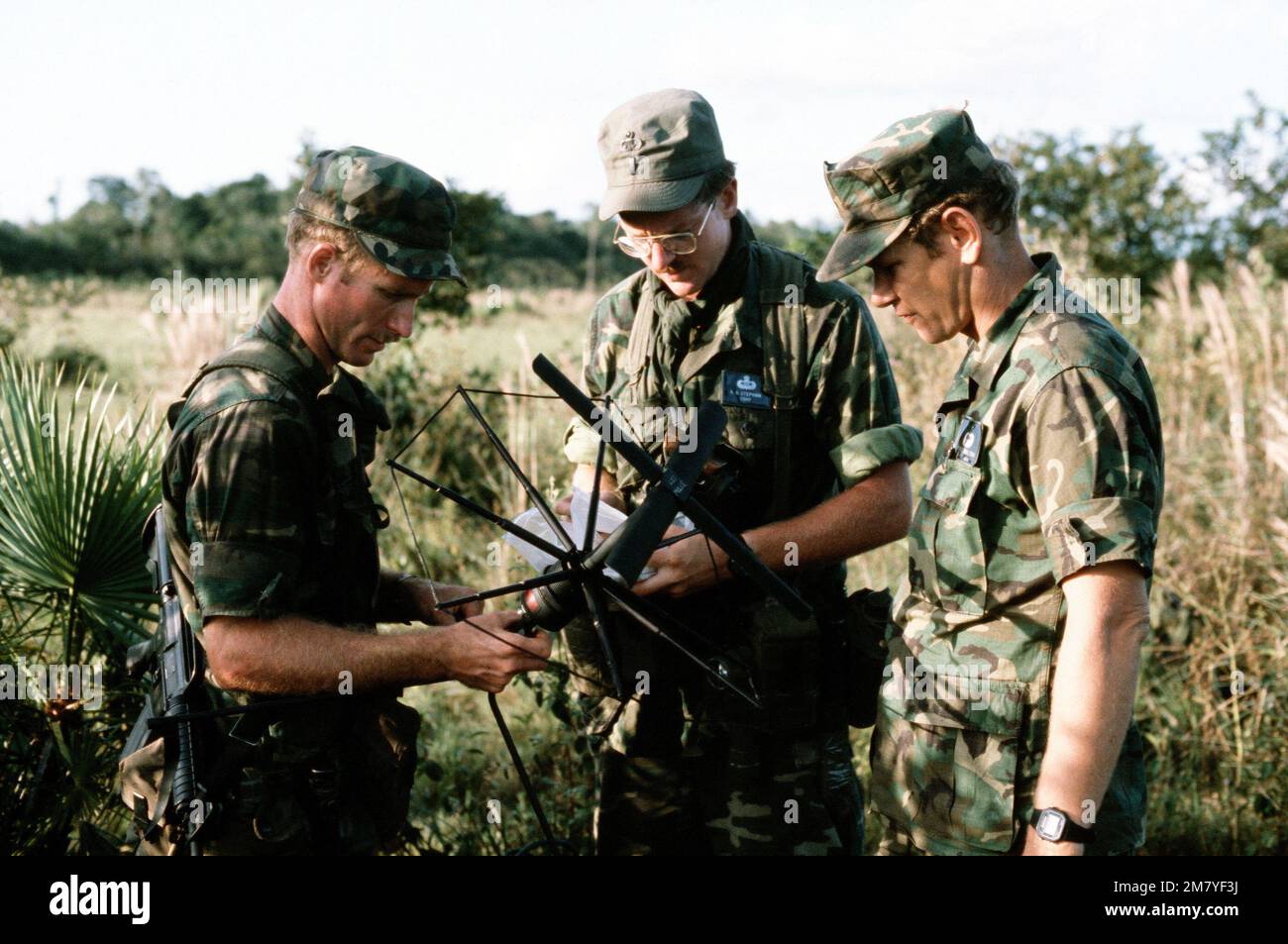Members of the combat control team (CCT) set up a satellite ...