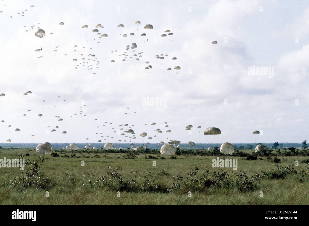 Honduran Army paratroopers descend into the landing zone during the ...