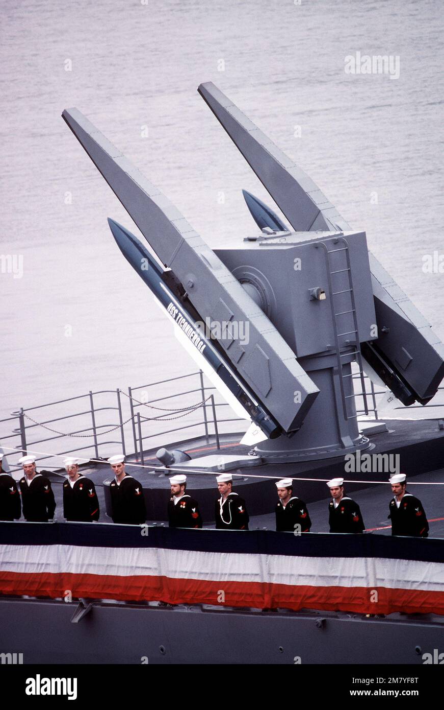 Crew members man the rail aboard the first Aegis guided missile cruiser ...