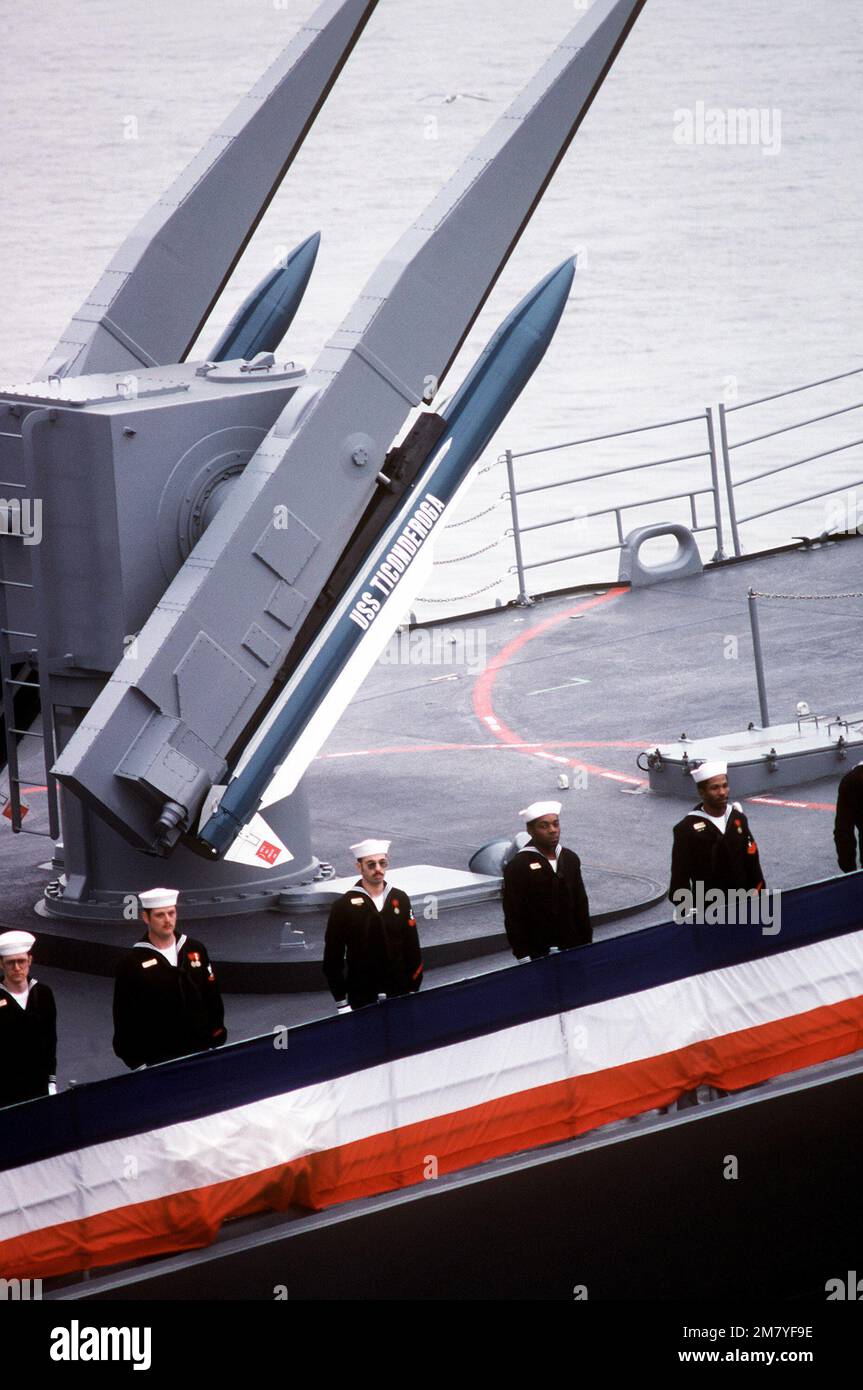 Crew members man the rail aboard the first Aegis guided missile cruiser ...