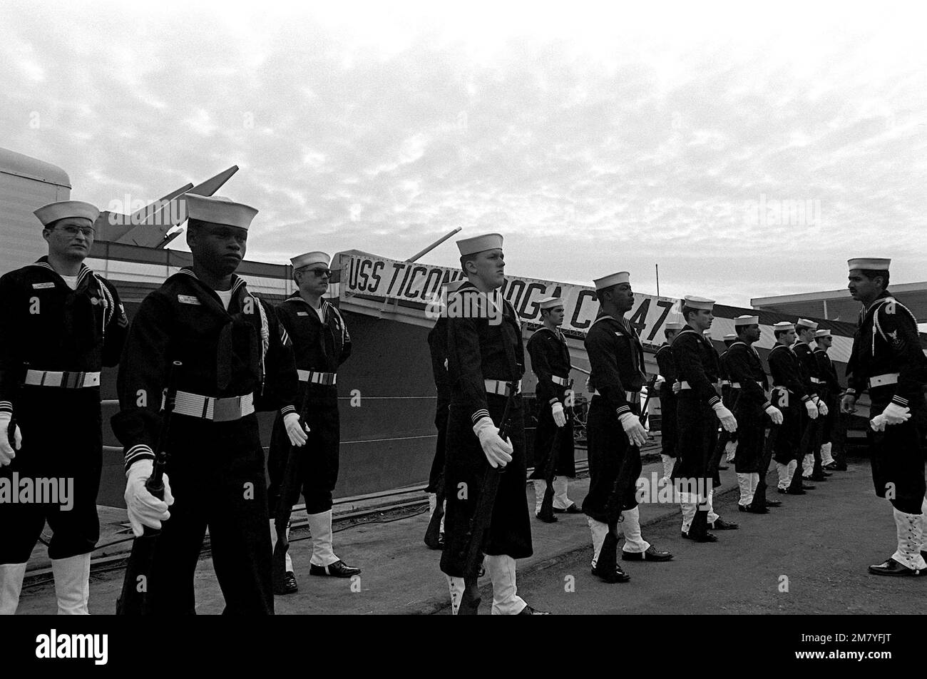 An honor guard stands at the parade rest during commissioning ...