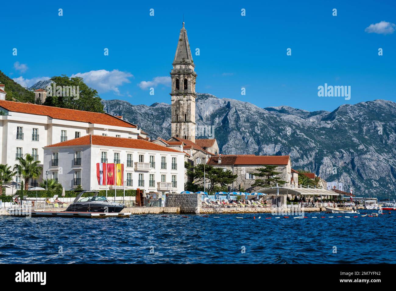 Bell tower of Church of St Nicholas on waterfront of old town of Perast ...