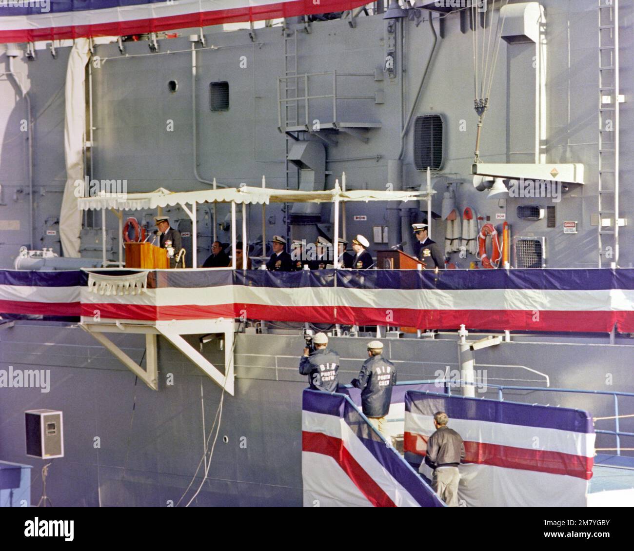A speaker addresses guests during the commissioningof the guided ...