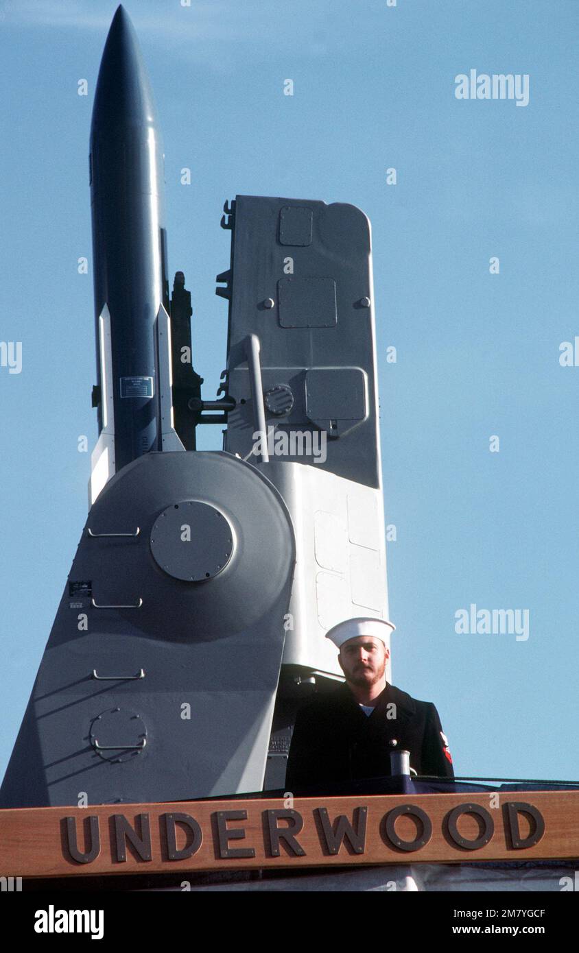 A petty officer mans the rail aboard the guided missile frigate USS ...