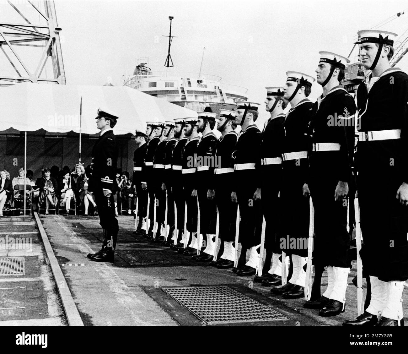 The crew of the Australian frigate HMAS SYDNEY (F-03) stand at ...
