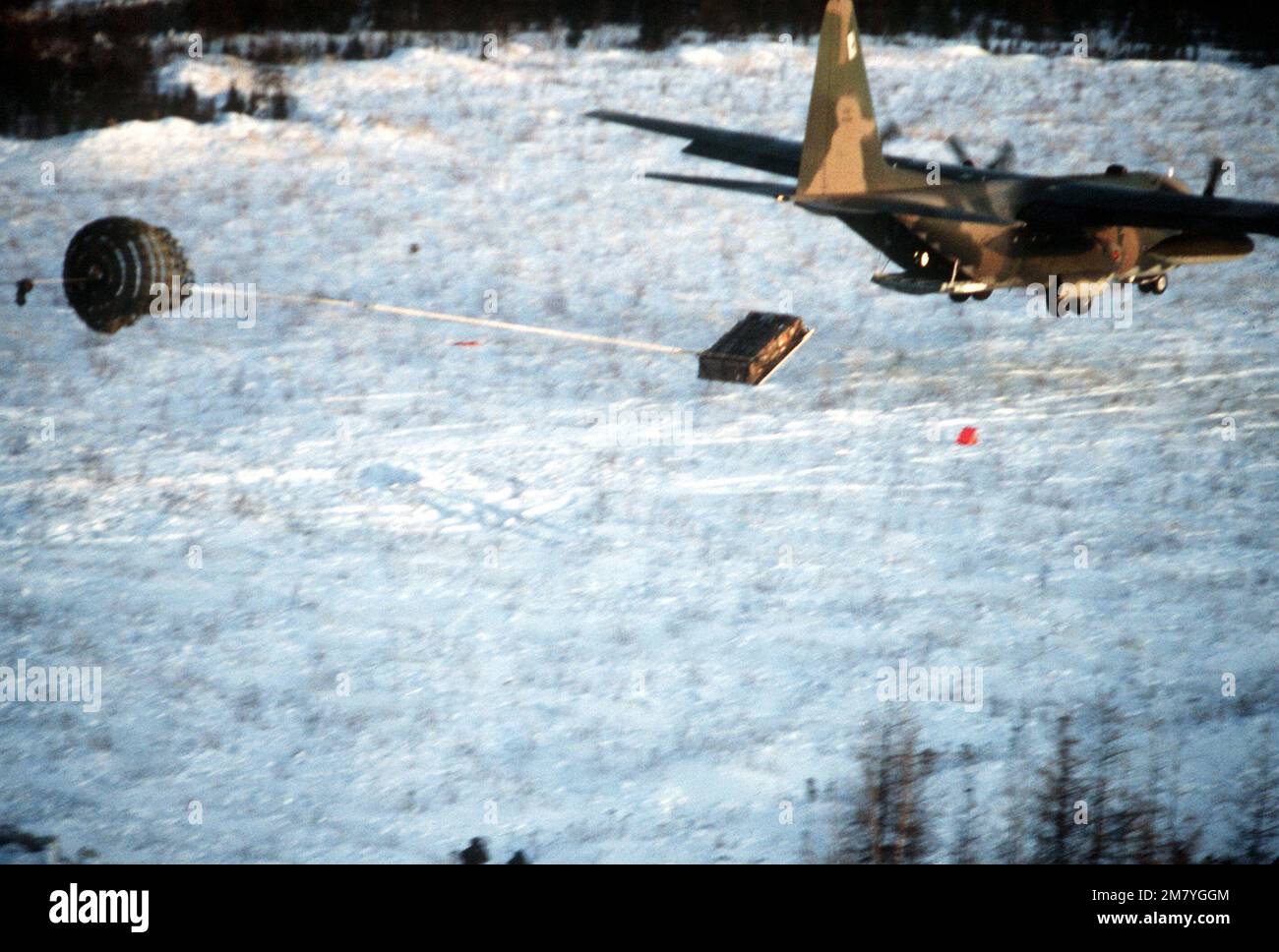 Right rear view of a C-130 Hercules aircraft as crewmen conduct a Low ...