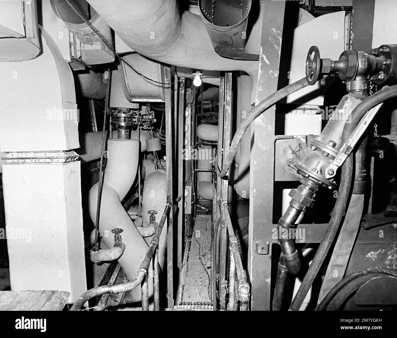 An interior view of the engine room on the guided missile frigate USS ...