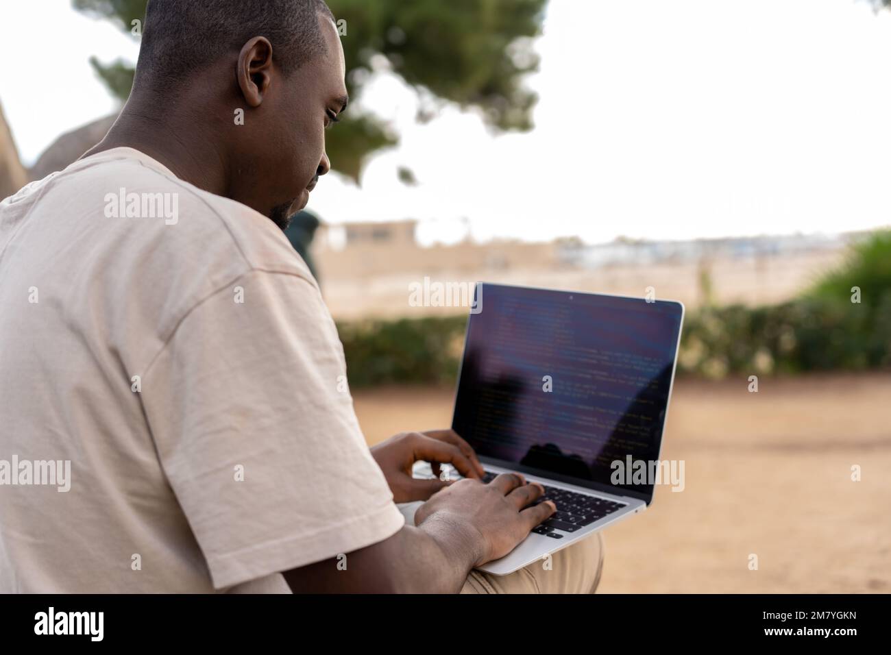Black Man Typing On Laptop Keyboard And Creating Code While Working On