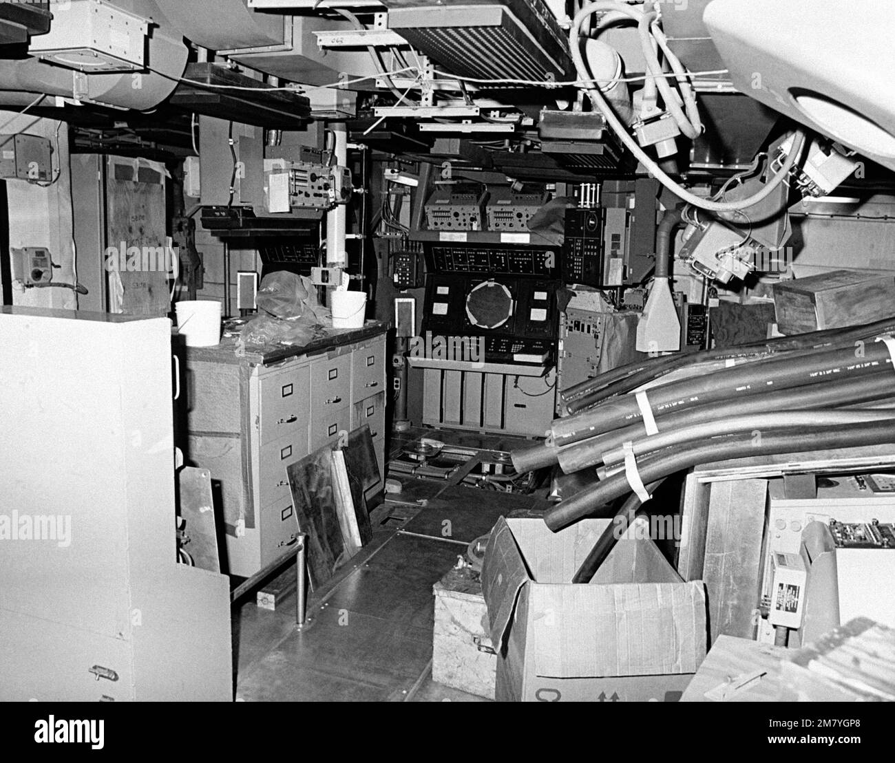 An interior view of the combat information center on the guided missile ...