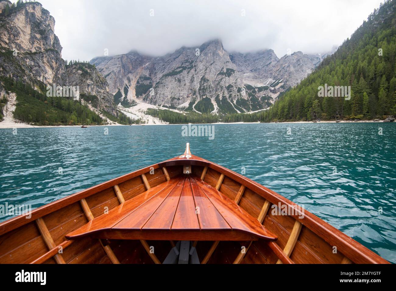 Wooden rowing boats for hire on Lago di Braies in the Dolomites, Italy ...