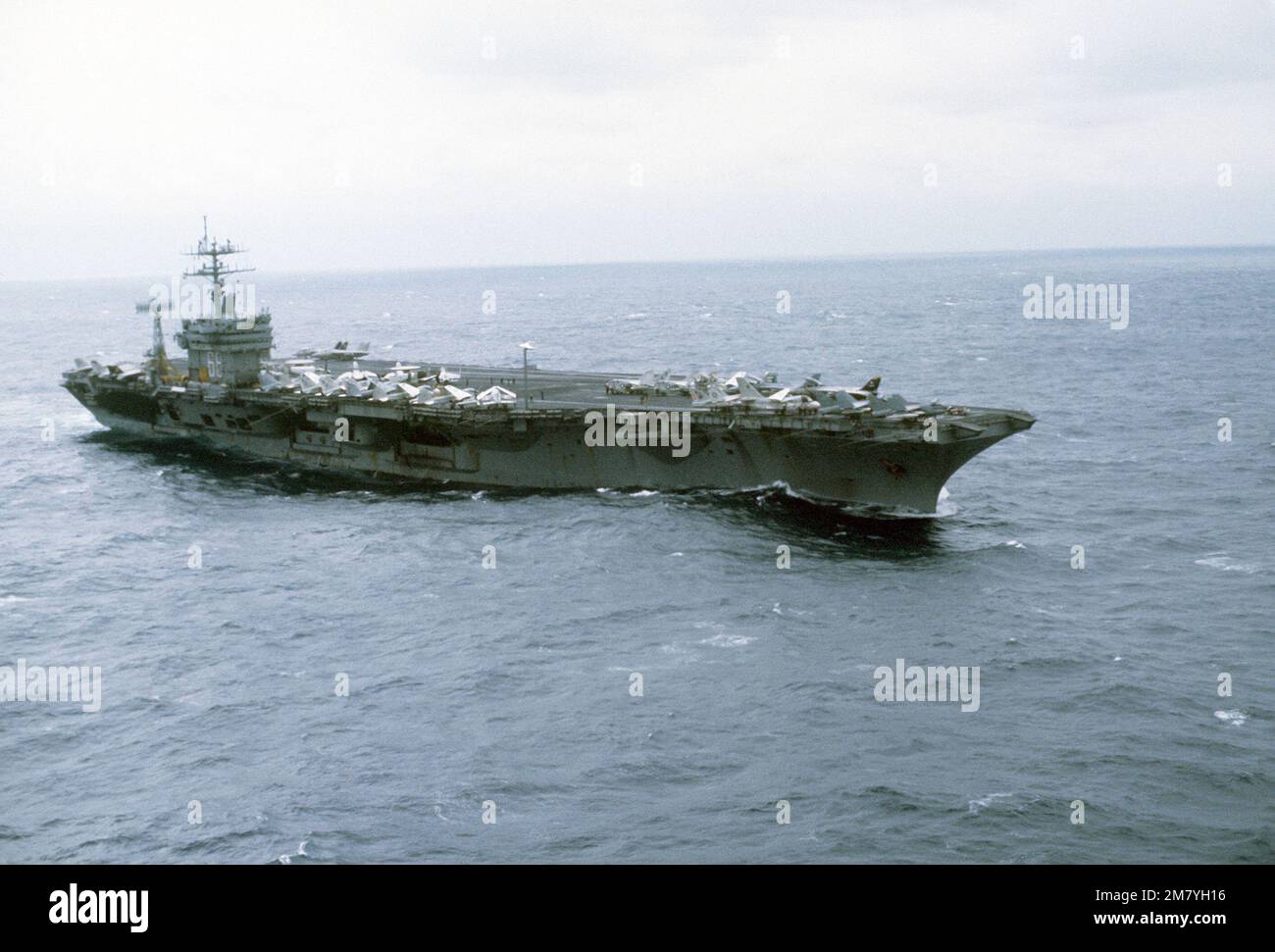 An aerial starboard bow view of the nuclear-powered aircraft carrier USS NIMITZ (CVN-68 ...