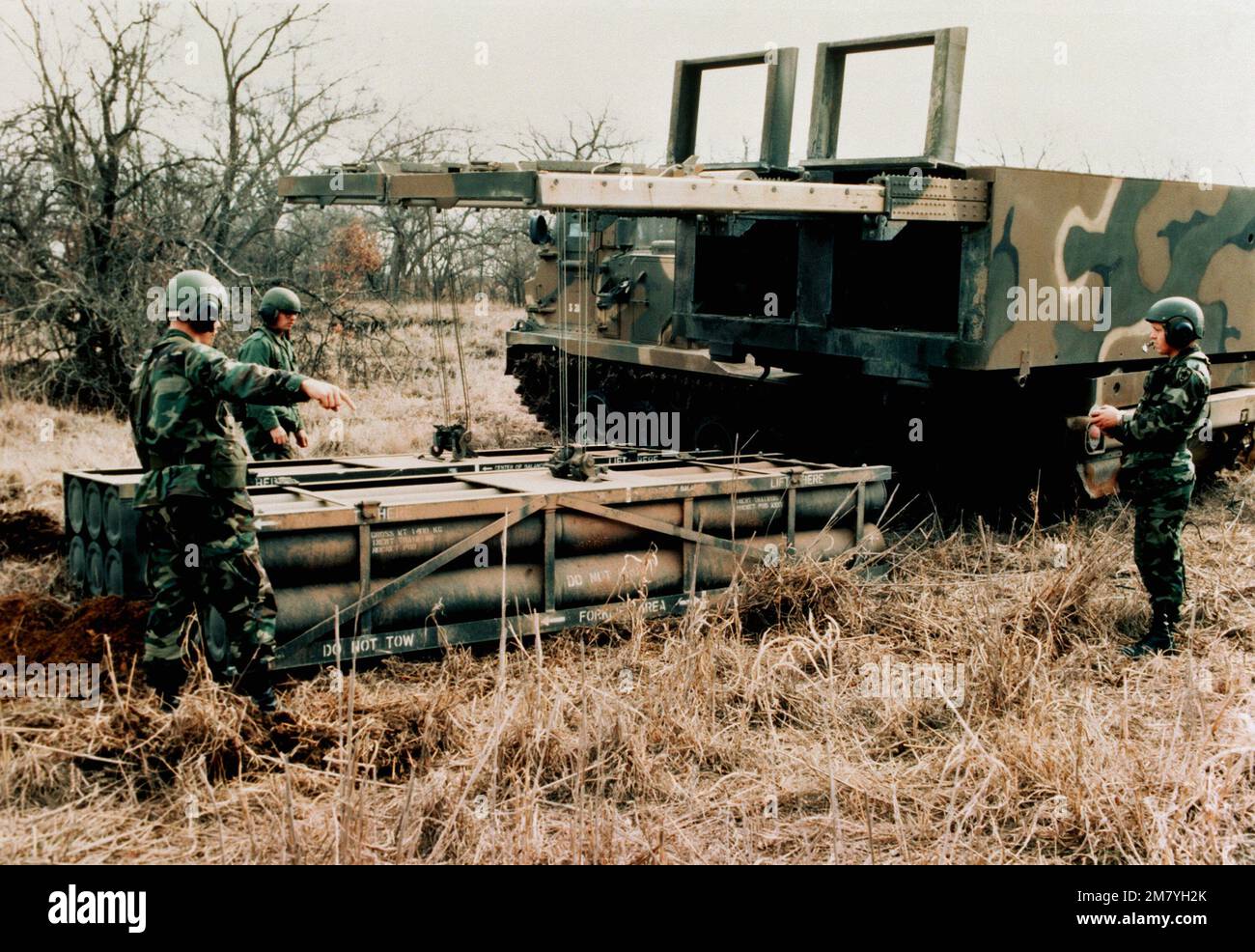 Multiple launch rocket system (MLRS) rockets are uploaded into a self ...