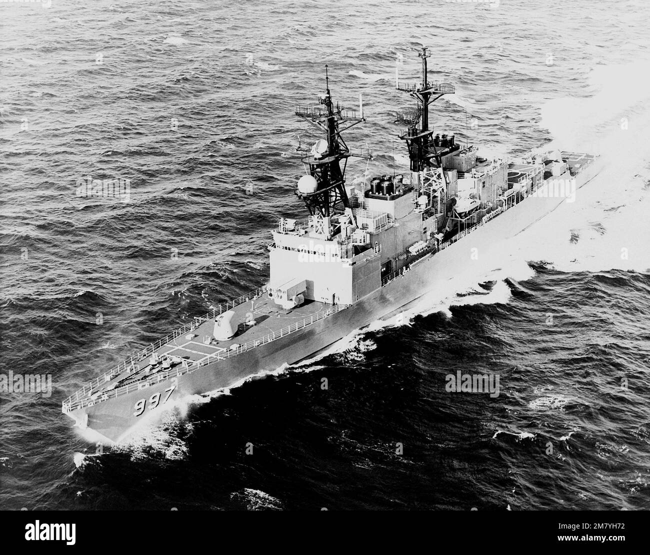 An elevated port bow view of the destroyer USS HAYLER (DD-997) underway ...