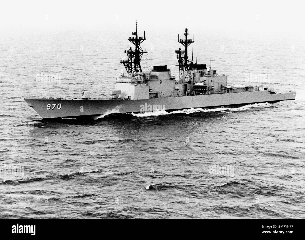 Aerial port bow view of the destroyer USS CARON (DD-970) underway ...