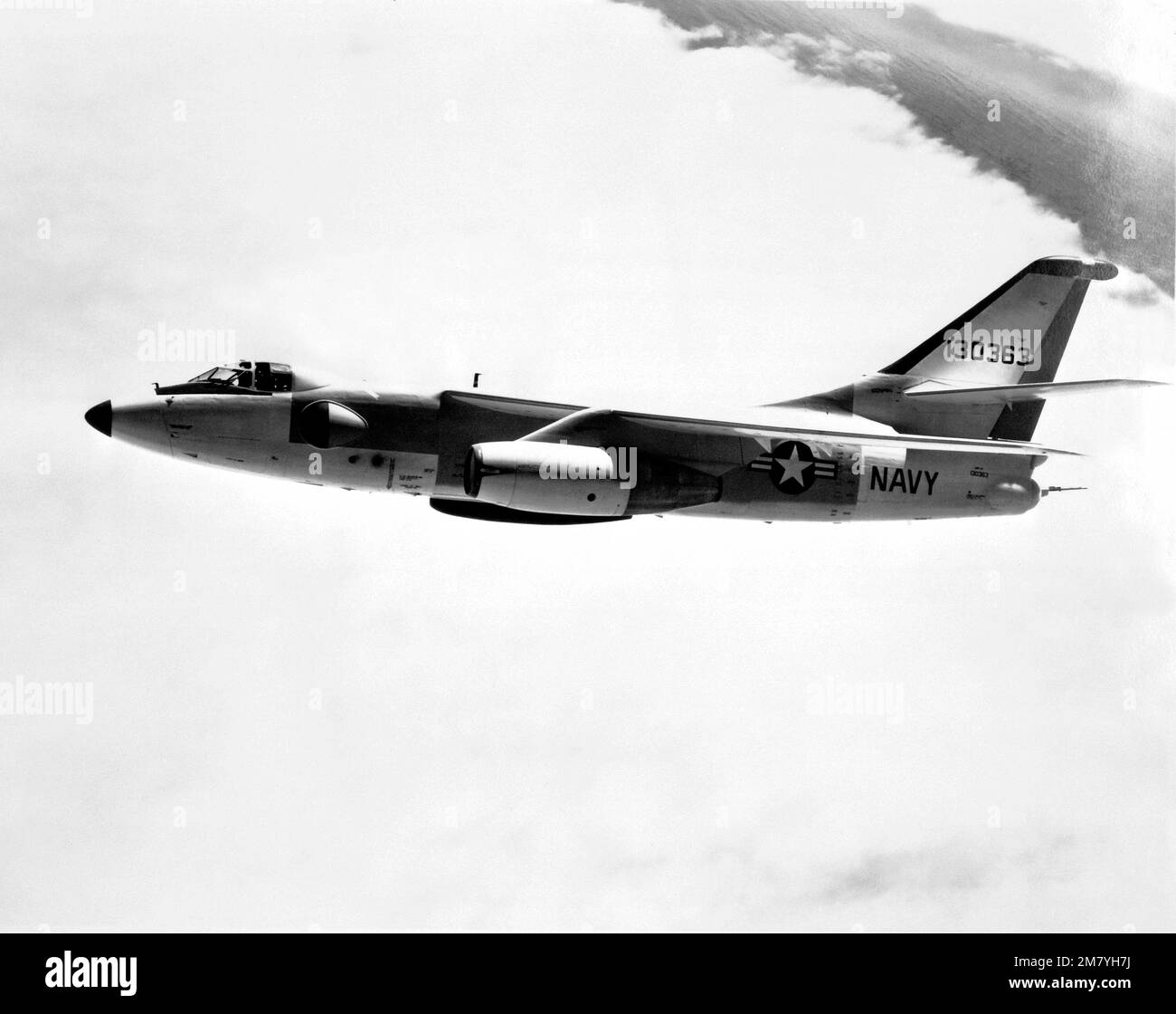 An air-to-air left side view of a Douglas A3D-1Q Skywarrior aircraft ...