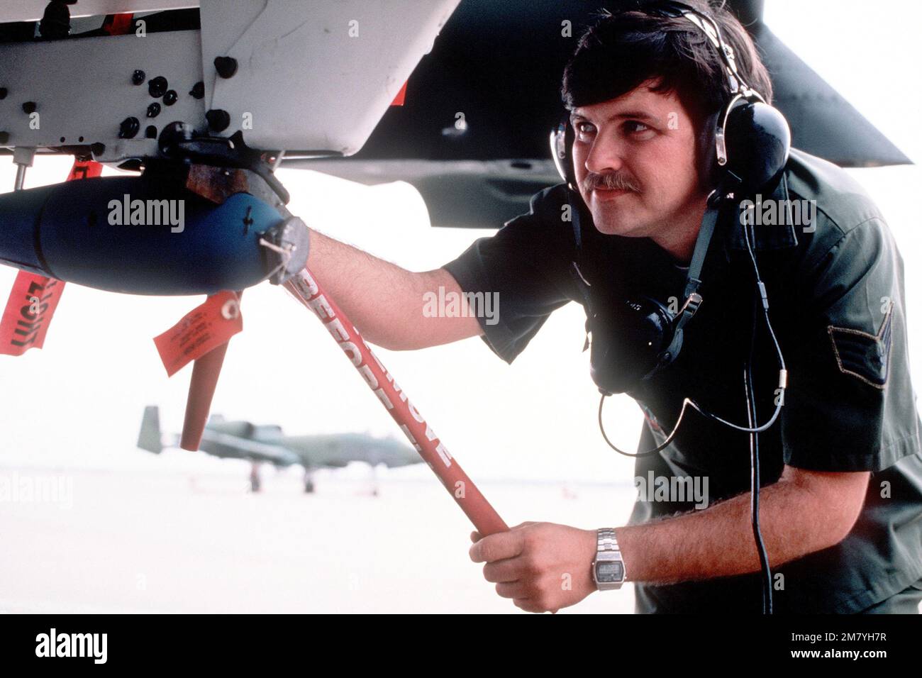 Air Force Reserve flight line mechanic SSGT Buddy Harris removes the ...
