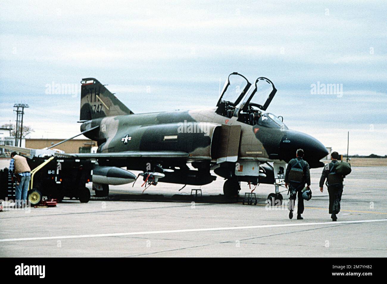 BGEN Roger Scheer and CPT Don Sharp, his copilot, prepare to climb ...