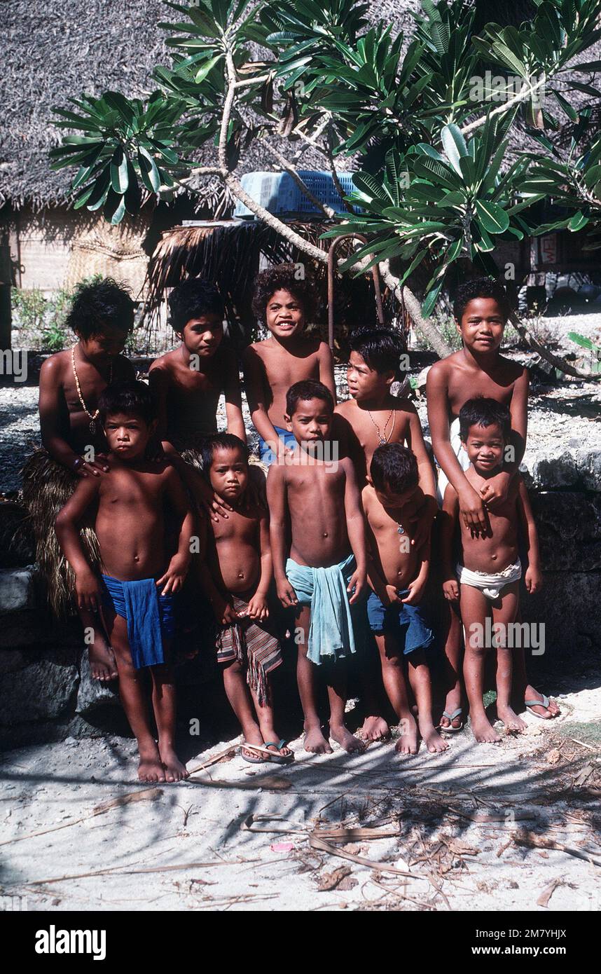 Native children pose for a photograph at the south end of the island ...