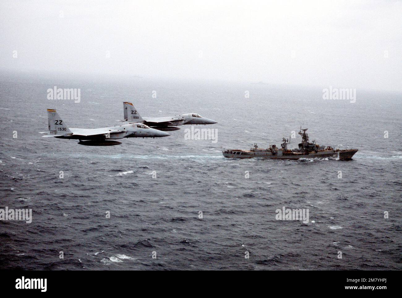 An air-to-air right side view of two F-15 Eagle aircraft from the 18th ...