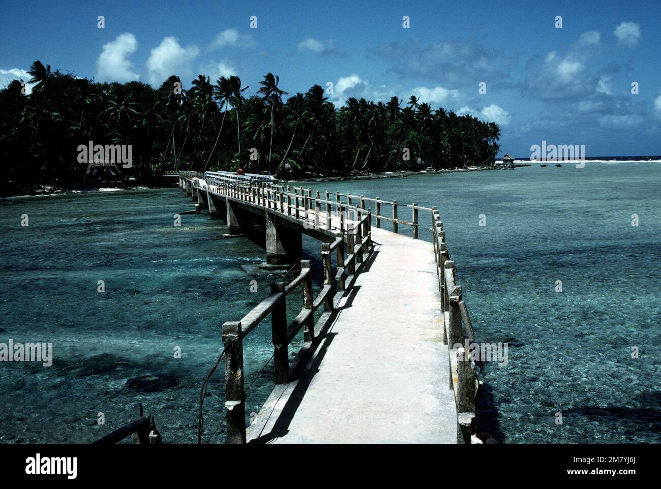 A view of a foot bridge connecting two islands. Country: Caroline ...