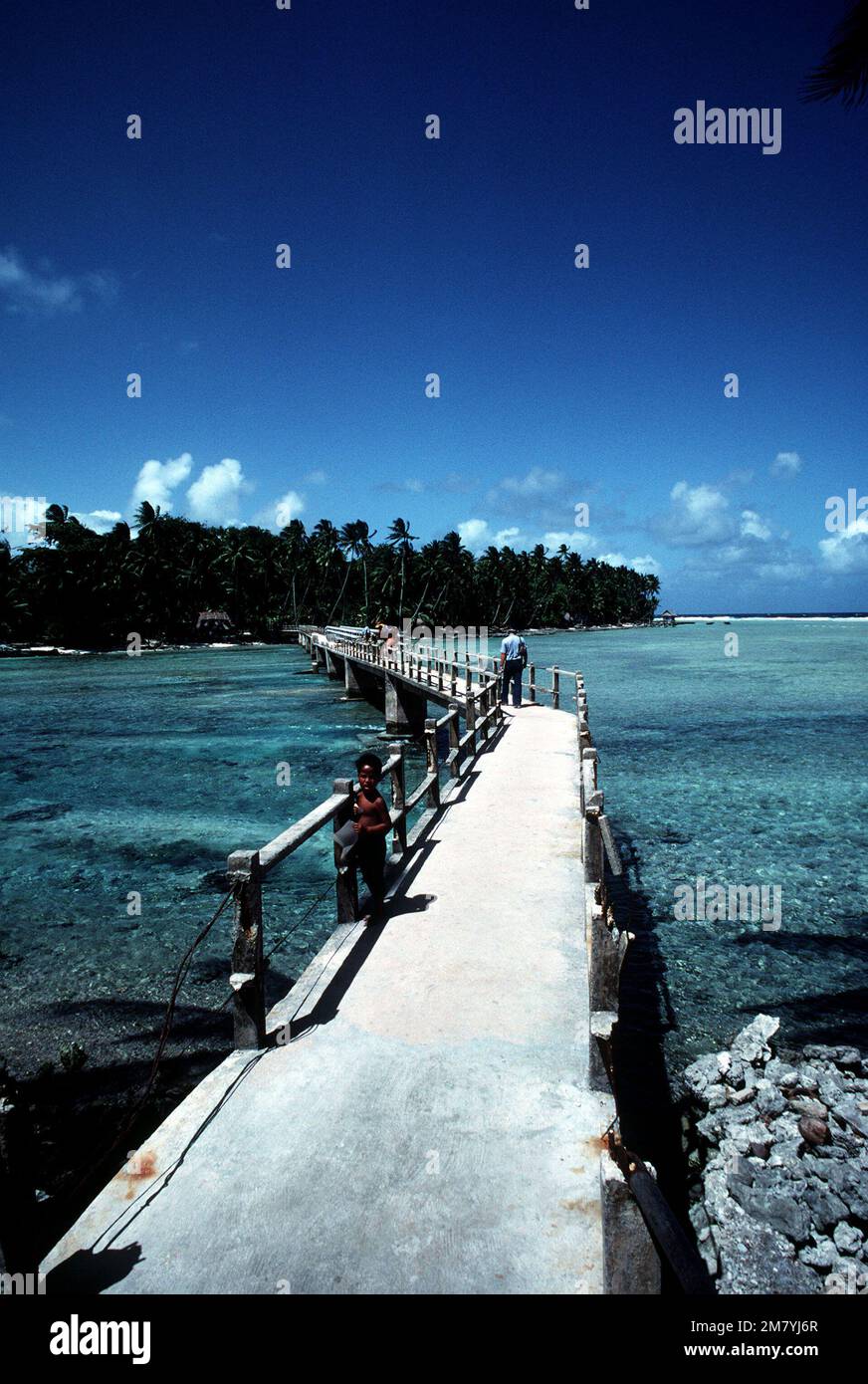 A view of a foot bridge connecting two islands. Country: Caroline ...