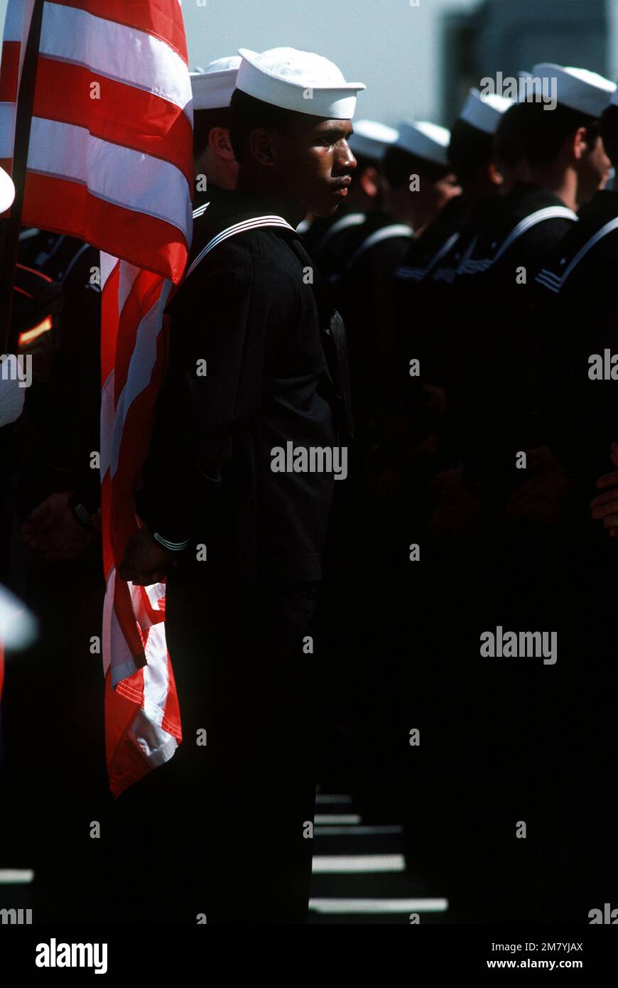 Crewmen stand at parade rest during commissioning ceremonies for the ...