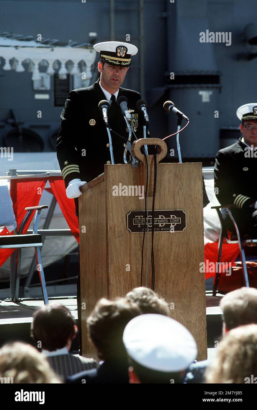 Prospective commanding officer, CDR Thomas J. Barnett, speaks during ...