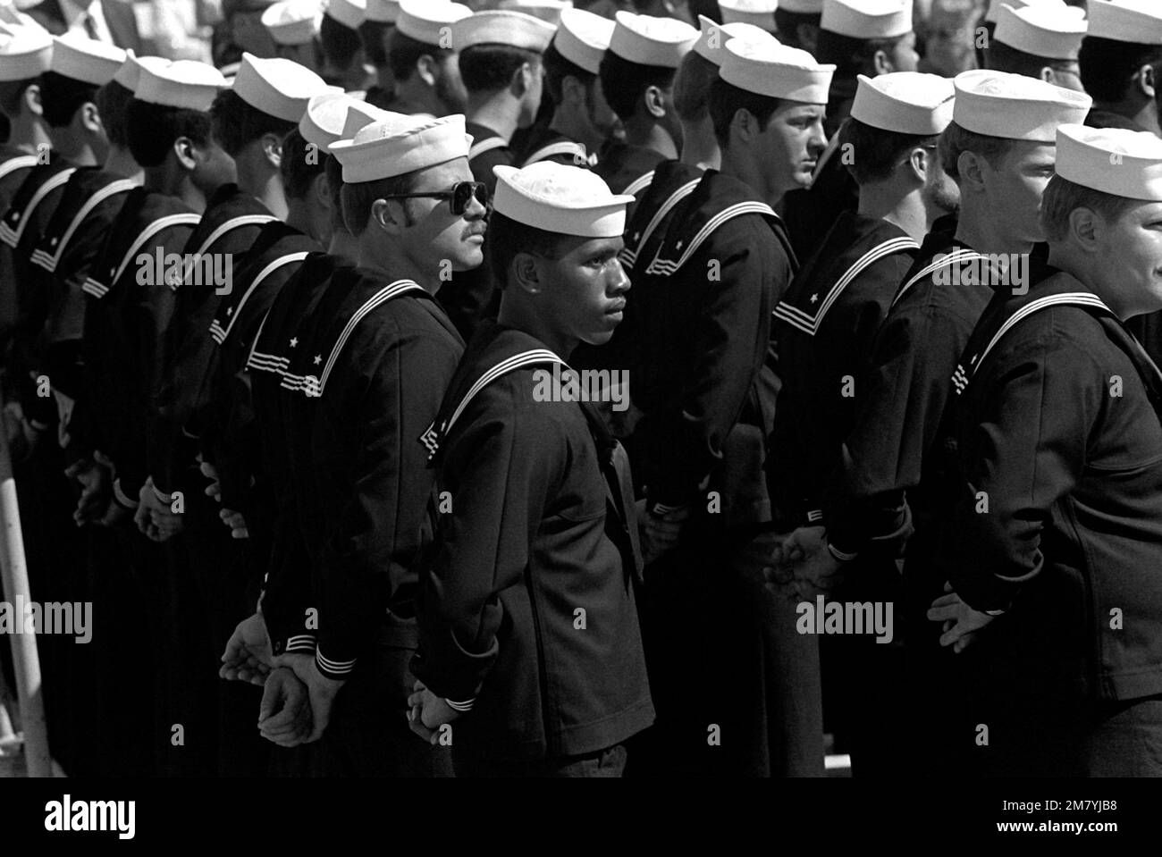 Crewmen stand at parade rest during commissioning ceremonies for the ...