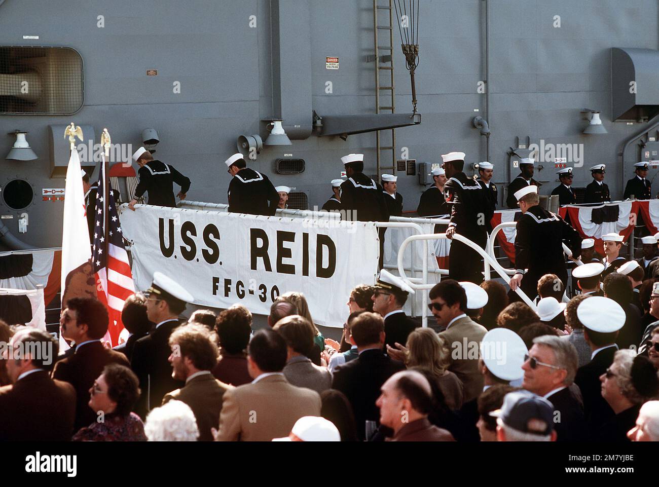 A view of the crewmen going aboard the guided missile frigate USS REID ...