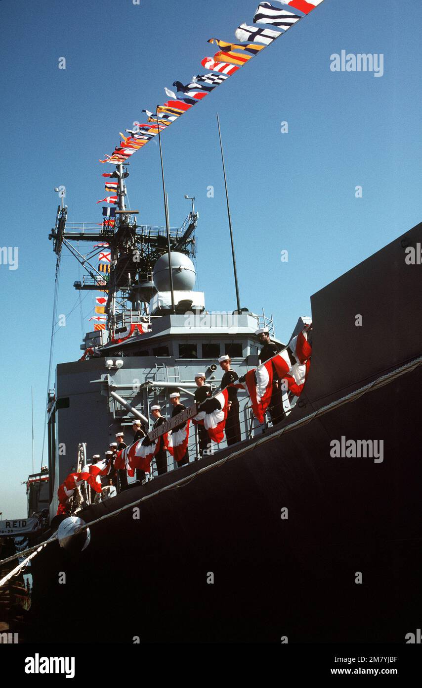 A view of the crew manning the starboard rail aboard the guided missile ...