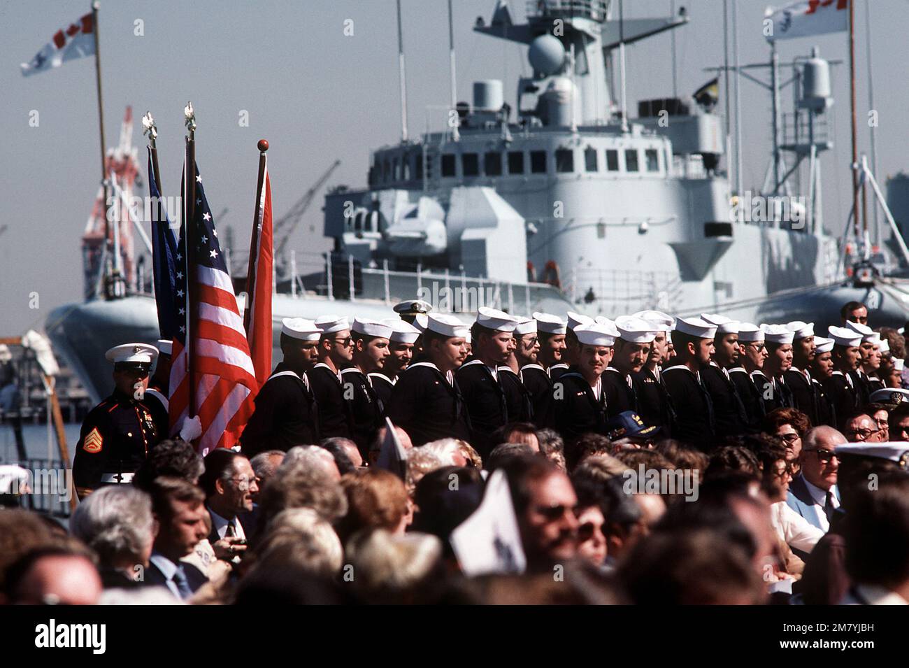 Crewmen stand at parade rest during commissioning ceremonies for the ...