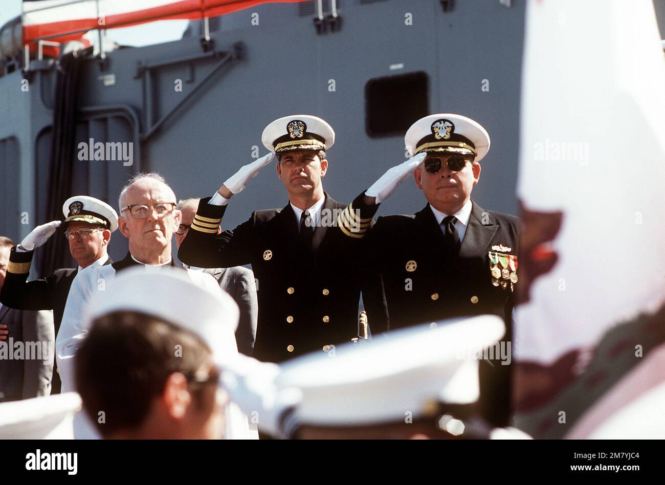 Distinguished guests salute from the speakers platform, as the national ...