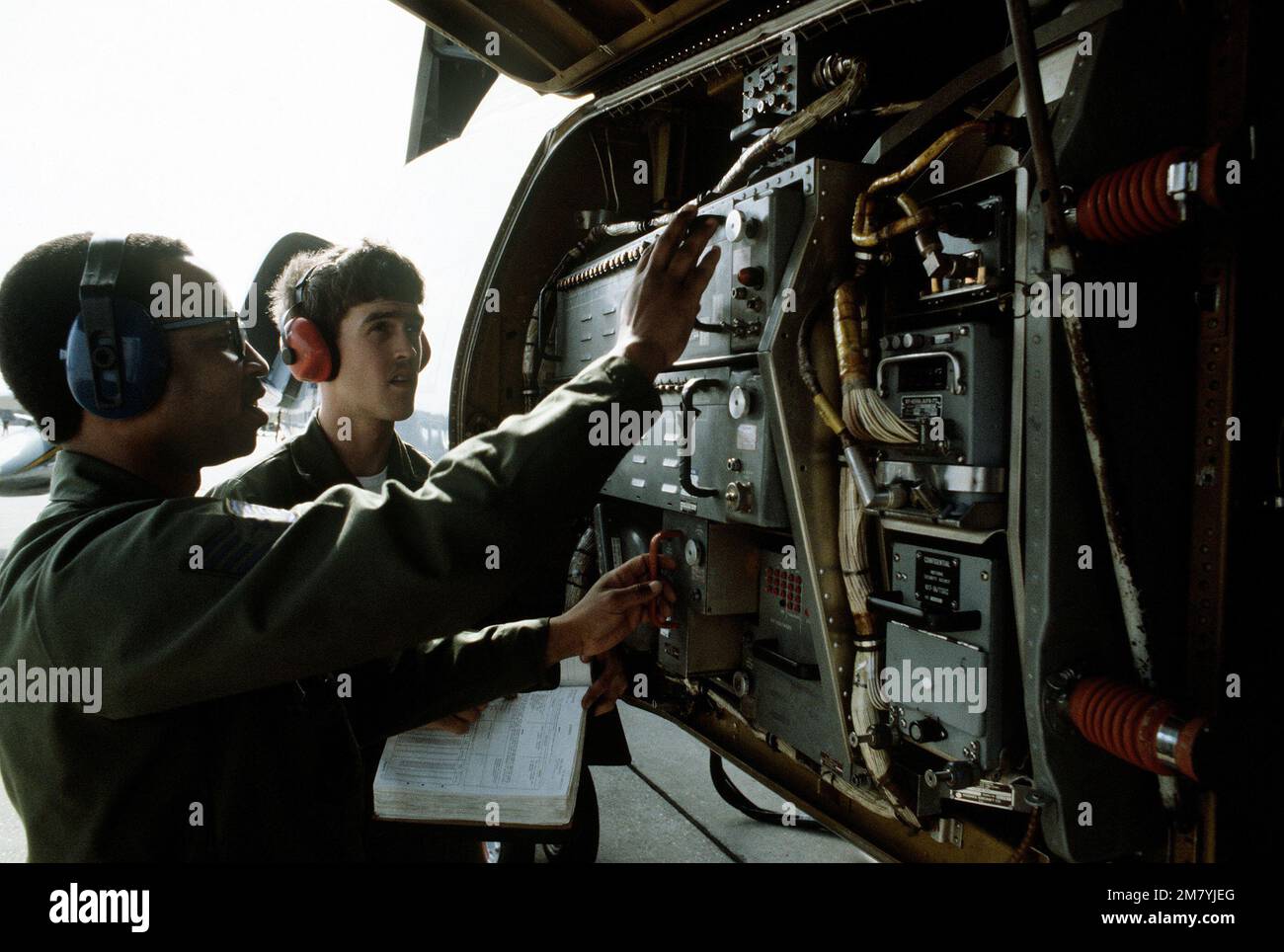 SSGT Andrew Davis, right, weapons control systems technician, and AMN ...