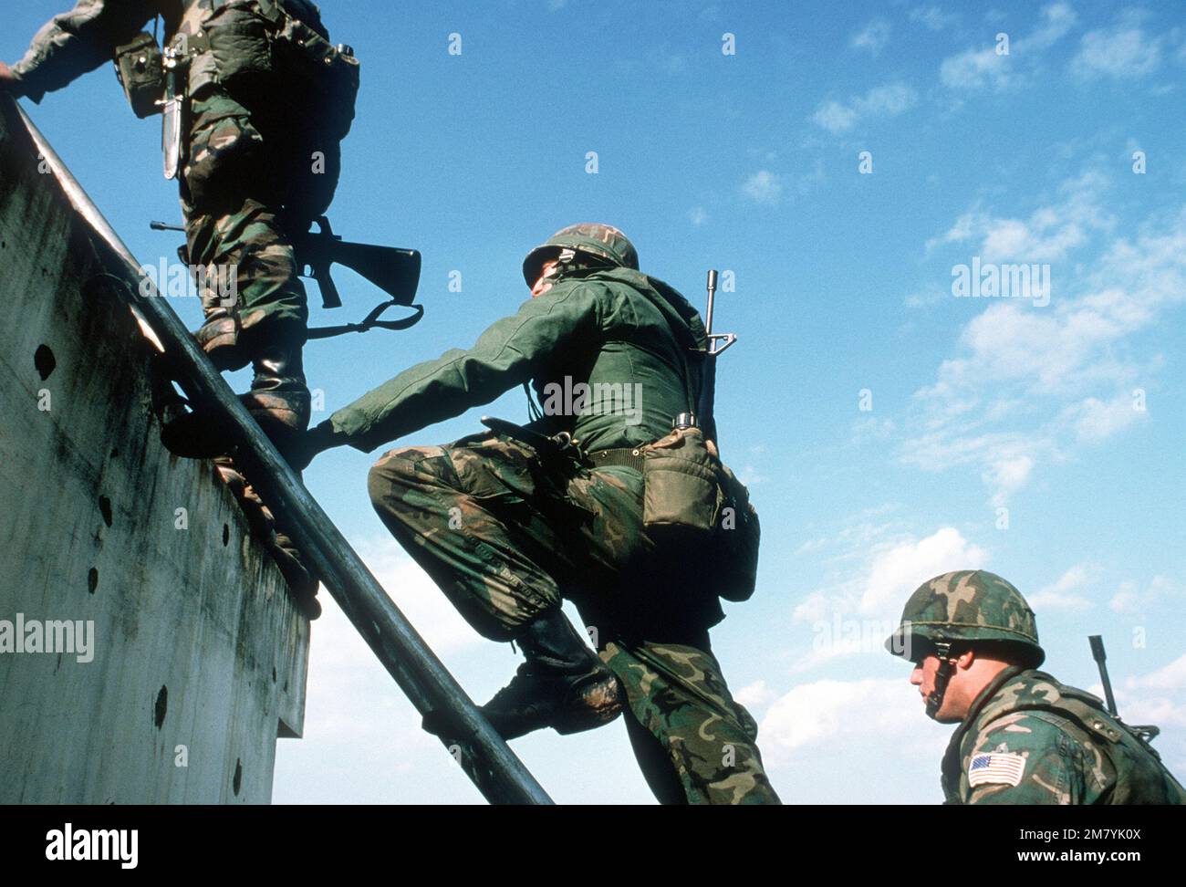 Marines climb a ladder to an observation position at the Lebanese ...