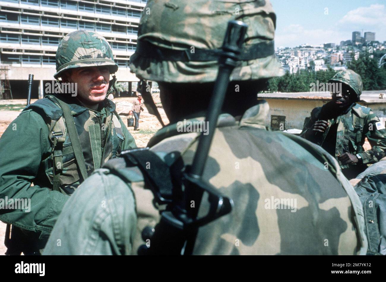 A briefing takes place between Marines prior to their departure on foot ...
