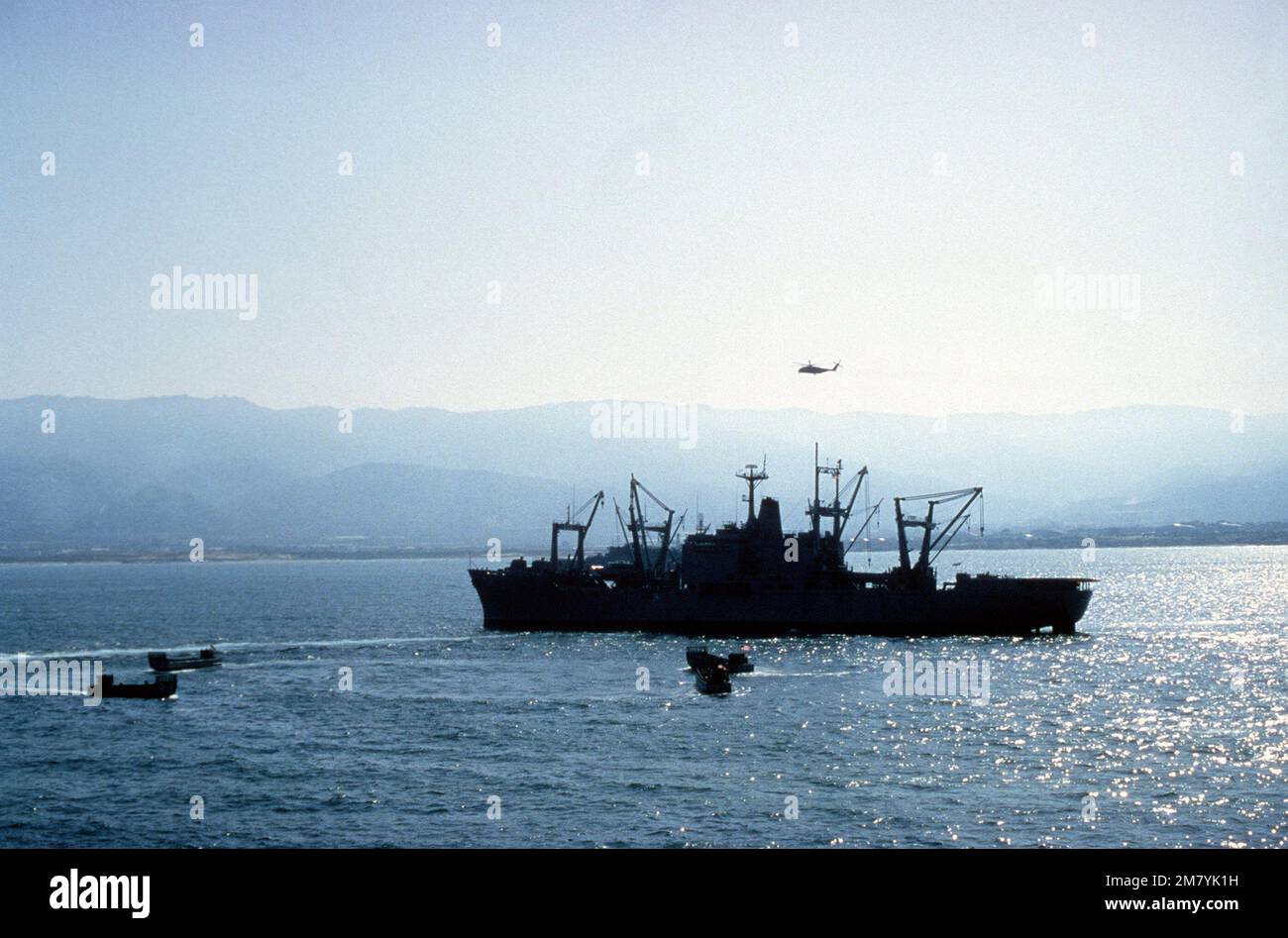 A port view of an amphibious cargo ship off the coast, as U.S. Marines ...