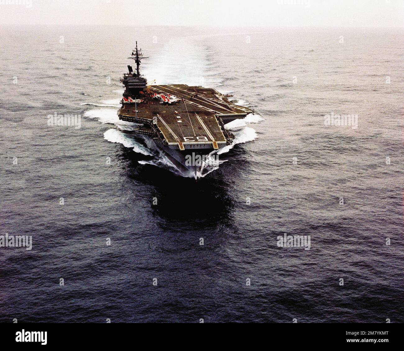 An aerial bow view of the aircraft carrier USS KITTY HAWK (CV 63 ...