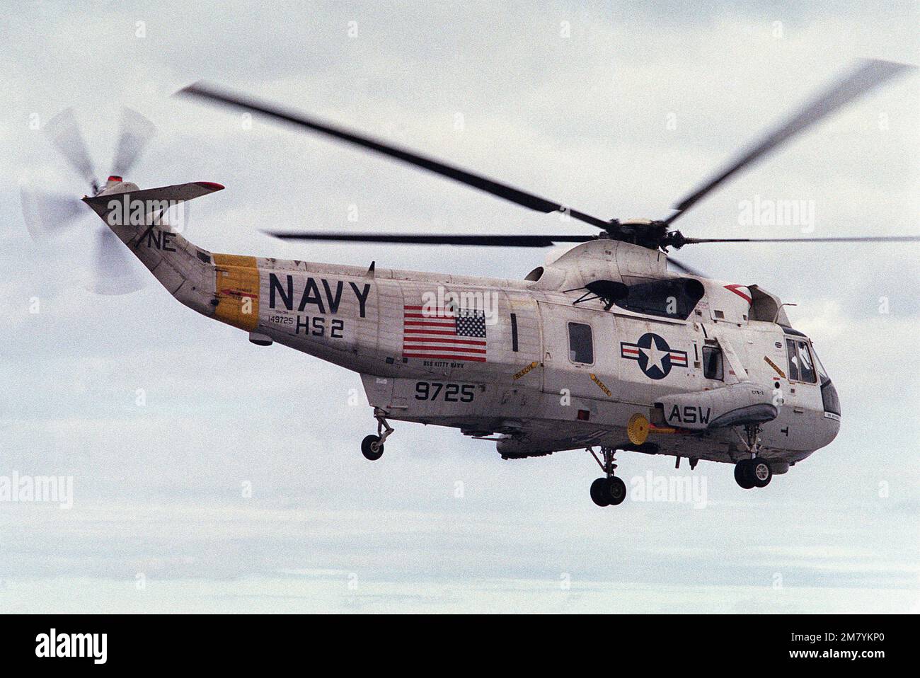 An air-to-air right side view of an SH-3A Sea King helicopter from ...