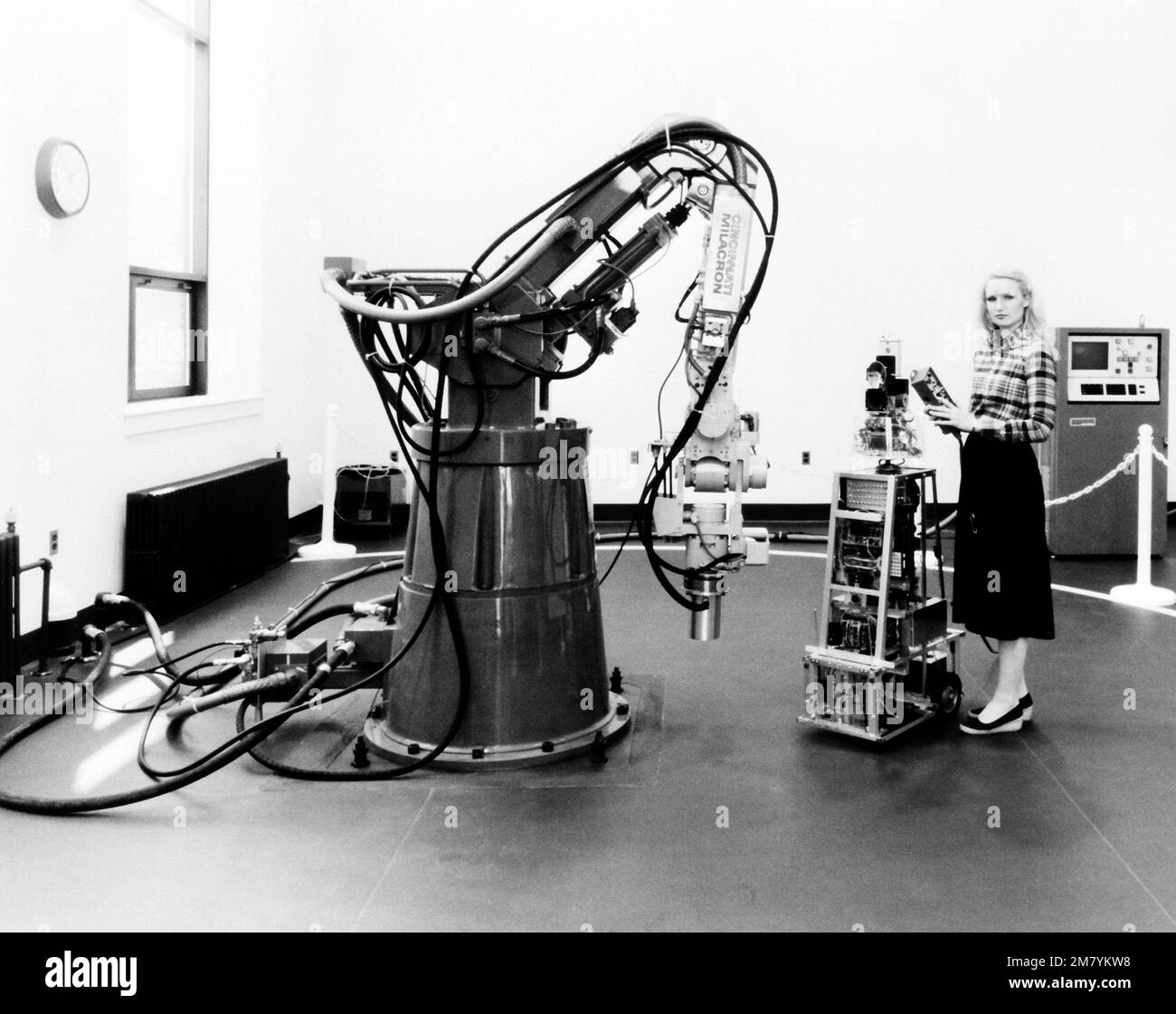 Sharon Hogge, an electronics engineer, poses with autonomous sentry ...