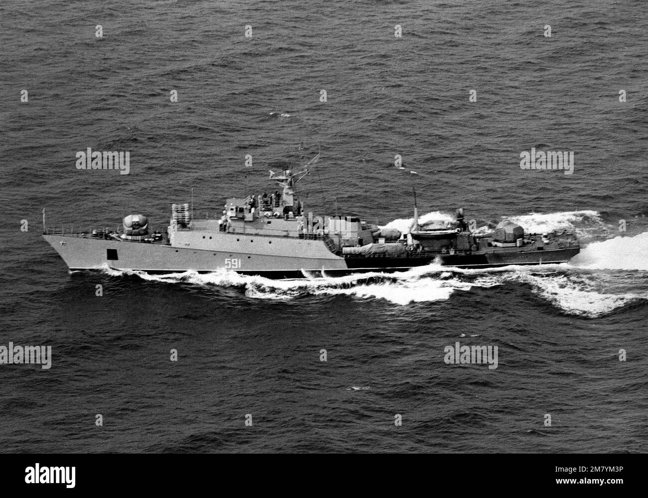 Aerial port beam view of a Soviet Grisha II class frigate underway ...