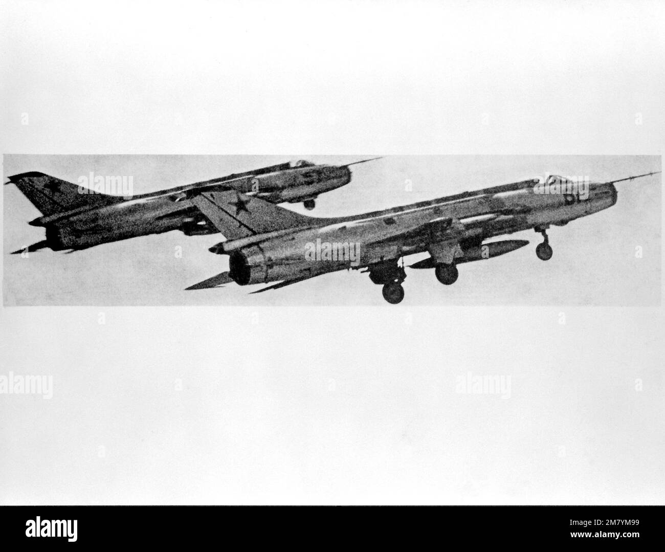 A right side view of two Soviet Su-17 Fitter-C aircraft in flight ...