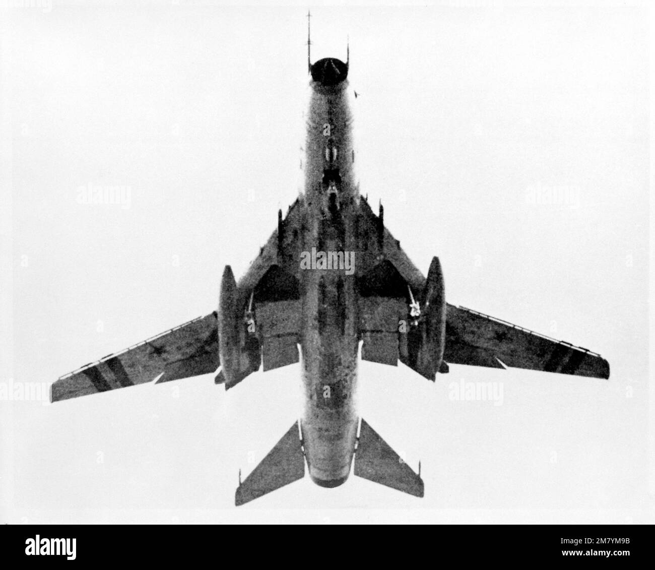 Under side view of a Soviet Su-17 Fitter-C aircraft in flight, with ...