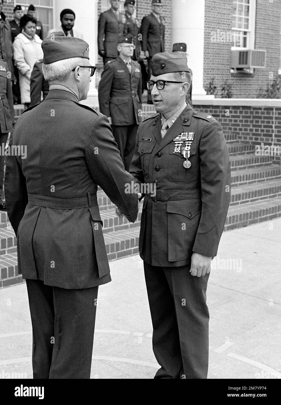 MGEN James McMonagle (left) congratulates LCOL Aultie Gerwig after ...