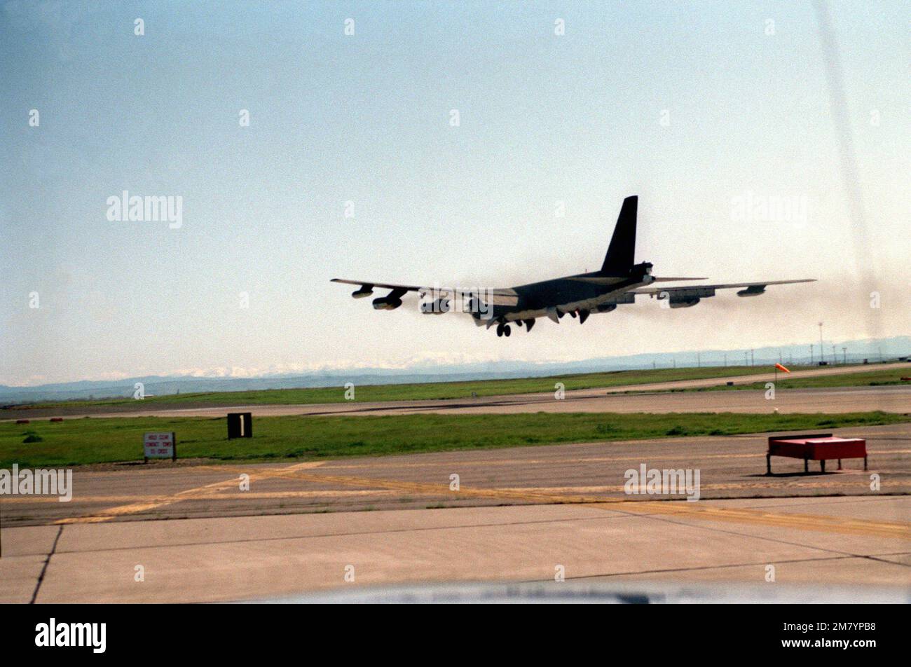 A left rear view of a B-52 Stratofortress as it takes off for the first ...