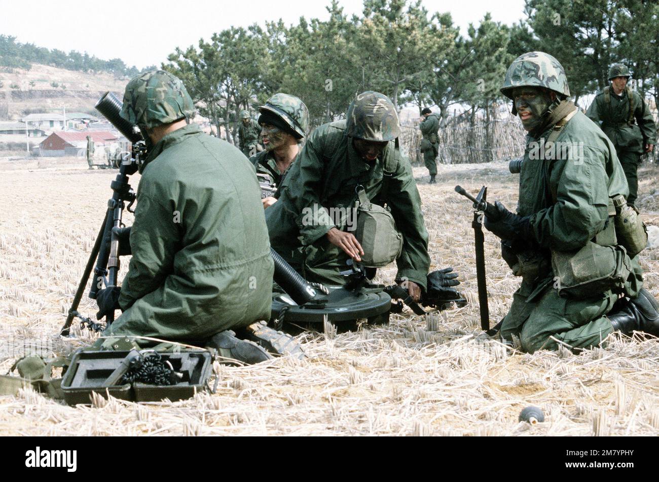 First Division Marines set up a mortar position to support advanced ...